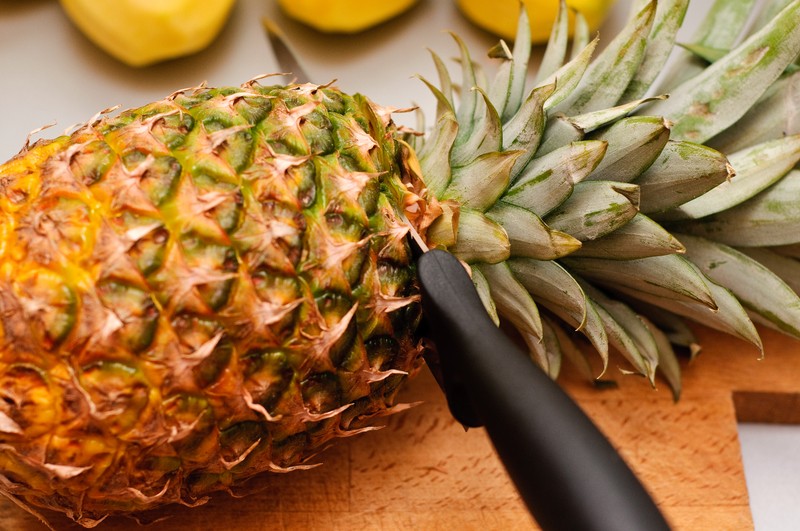 How To Cut Pineapple Without Making A Gigantic Mess Or Wasting The Best how-to-cut-pineapple-without-making-a-gigantic-mess-or-wasting-the-best